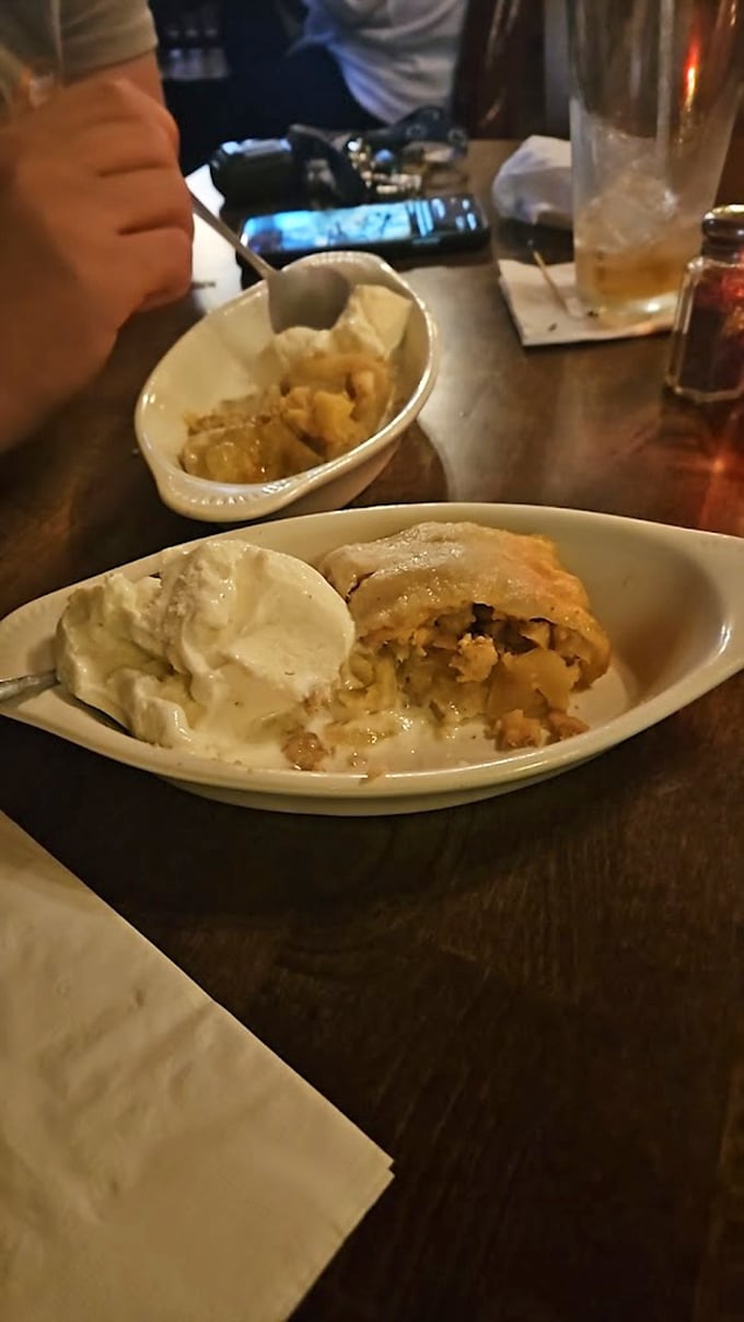 Apple strudel meets Irish hospitality – warm, cinnamon-scented comfort nestled beside a scoop of vanilla ice cream that's melting just right.