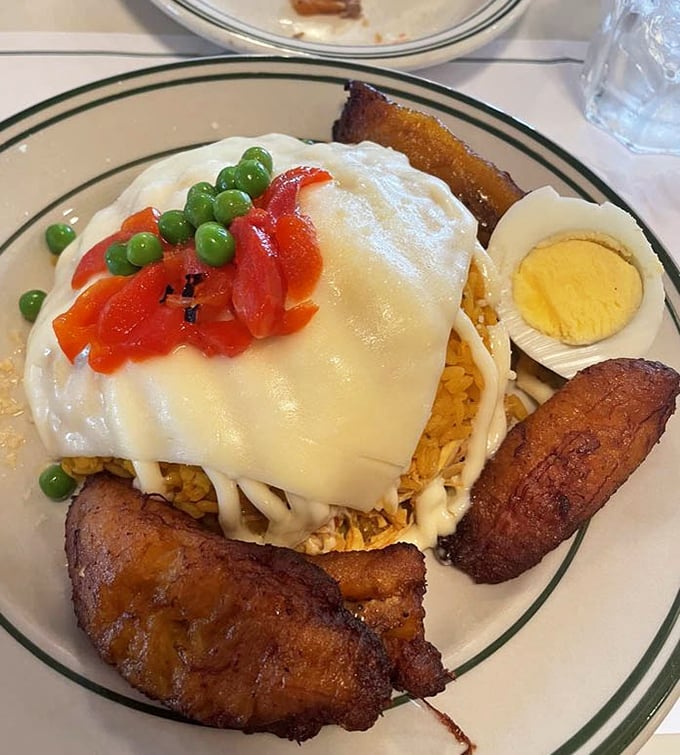 Arroz imperial crowned with melted cheese – it's comfort food wearing its Sunday best.