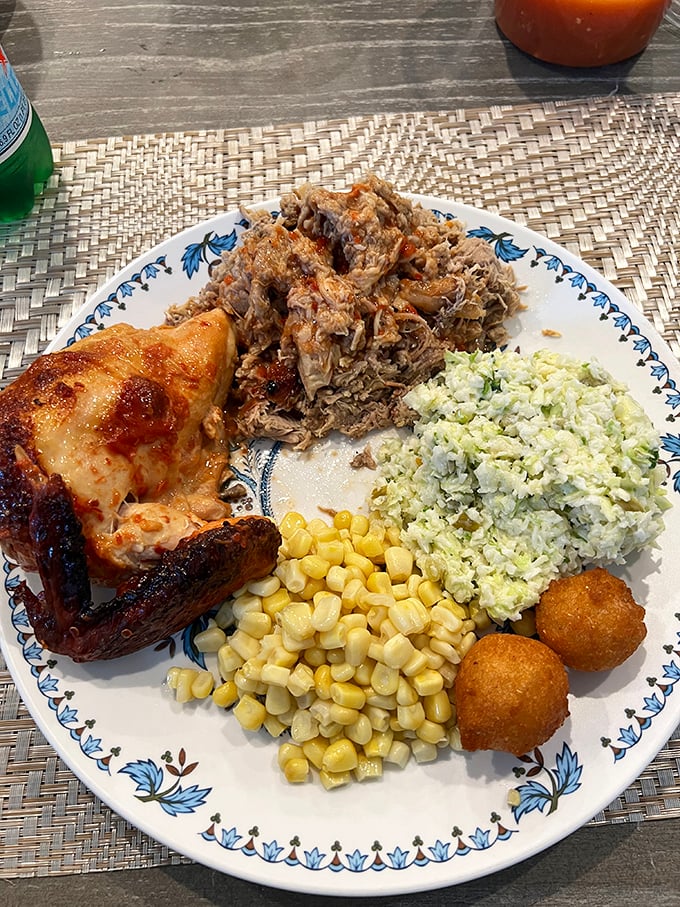 A plate that tells North Carolina's barbecue story—smoky chicken, tender pork, and sides that refuse to be mere supporting characters.