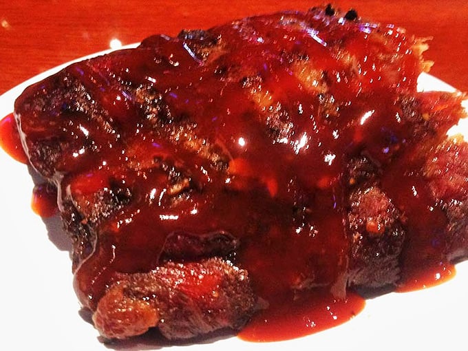 Glistening with sauce and tender enough to make you weep. These ribs don't just fall off the bone—they practically leap into your mouth.