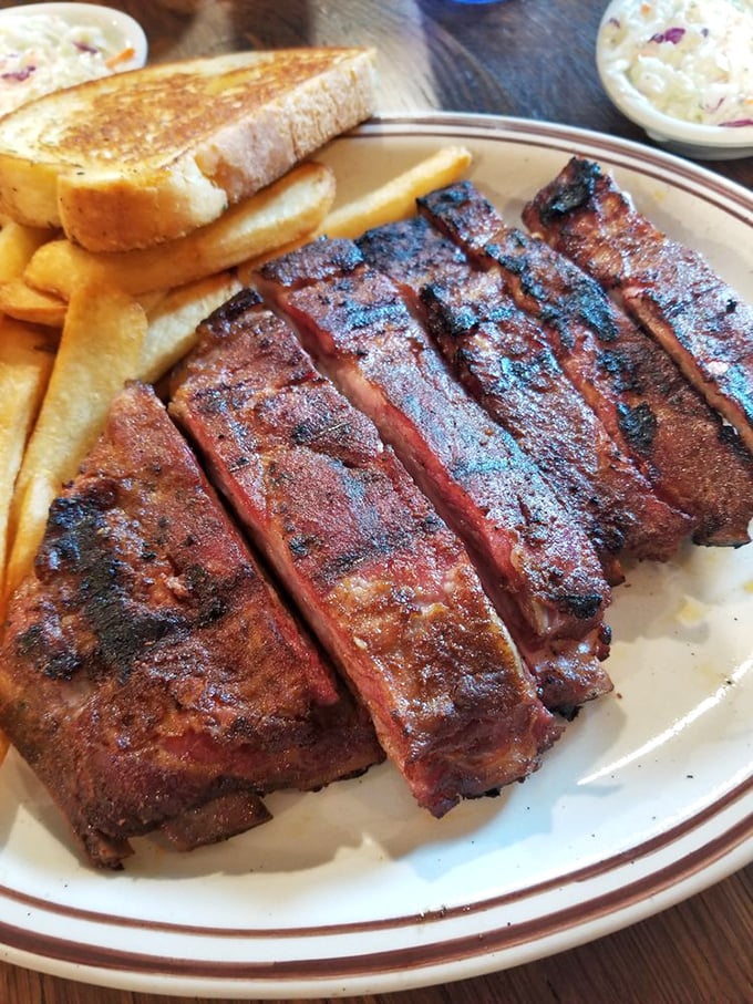 Ribs with a smoke ring so perfect it could be framed. That beautiful bark tells a story of patience, fire, and barbecue wisdom passed through generations.