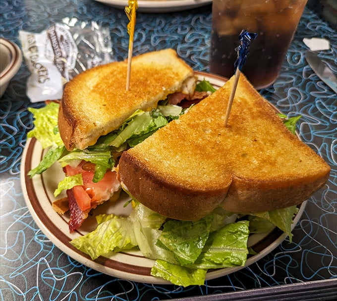 The perfect BLT isn't just a sandwich—it's architecture. Notice how those golden toast triangles stand proudly, guarding their treasure of bacon.