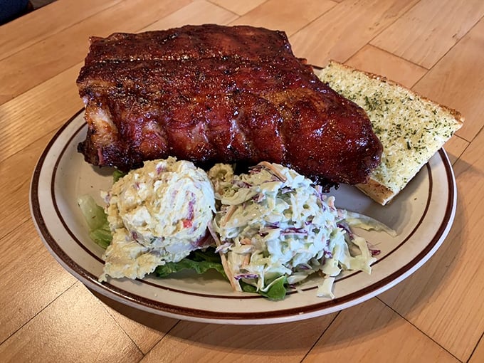 These ribs don't just fall off the bone—they practically leap onto your fork in a glorious display of barbecue physics.