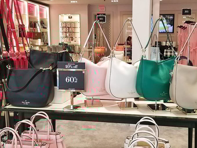 Kate Spade handbags stand at attention, their 60% off tags more attractive than their already gorgeous designs – proof that good taste and good sense can coexist.