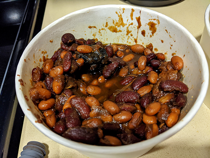 These aren't your average baked beans—they're meaty, sweet-savory flavor bombs that have clearly been simmering alongside barbecue royalty.