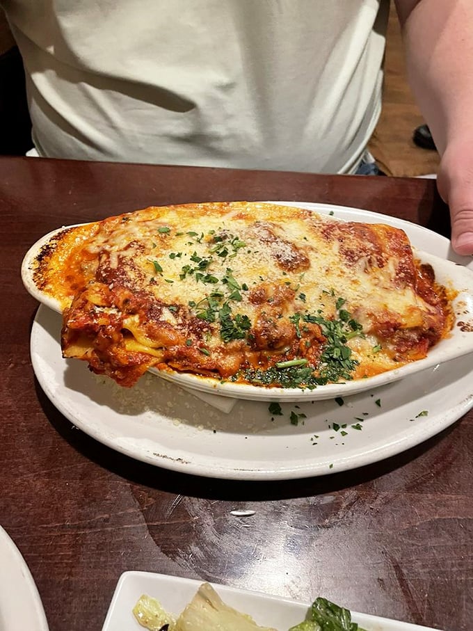 Lasagna that defies gravity—layers of pasta, cheese, and sauce creating a monument to excess that somehow maintains its structural integrity.