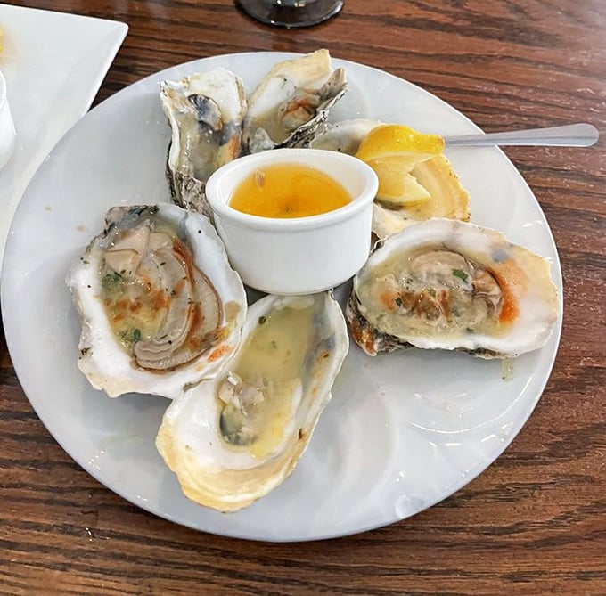 Baked oysters that look like they're auditioning for a seafood calendar—plump, glistening, and ready for their close-up before disappearing in one delicious bite.