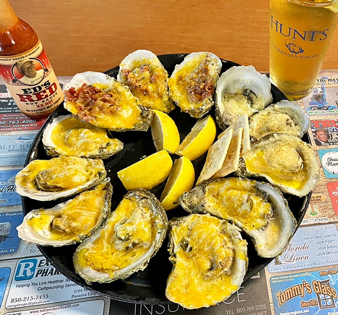 Baked oysters with cheese that create that perfect moment when the Gulf meets comfort food. The lemon wedges aren't just garnish—they're essential.