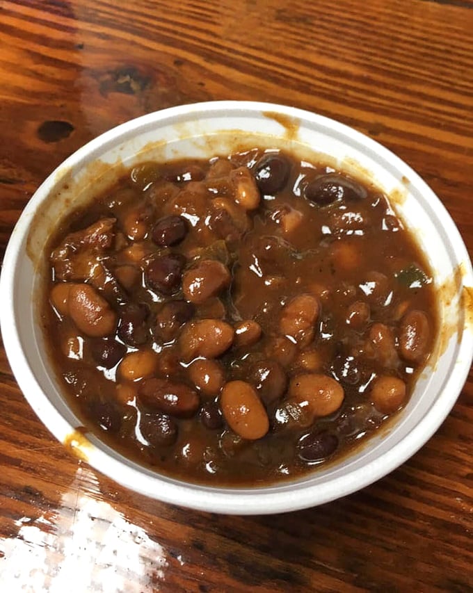 These baked beans have clearly been introduced to some smoky friends along the way – a neighborhood potluck in a single cup.