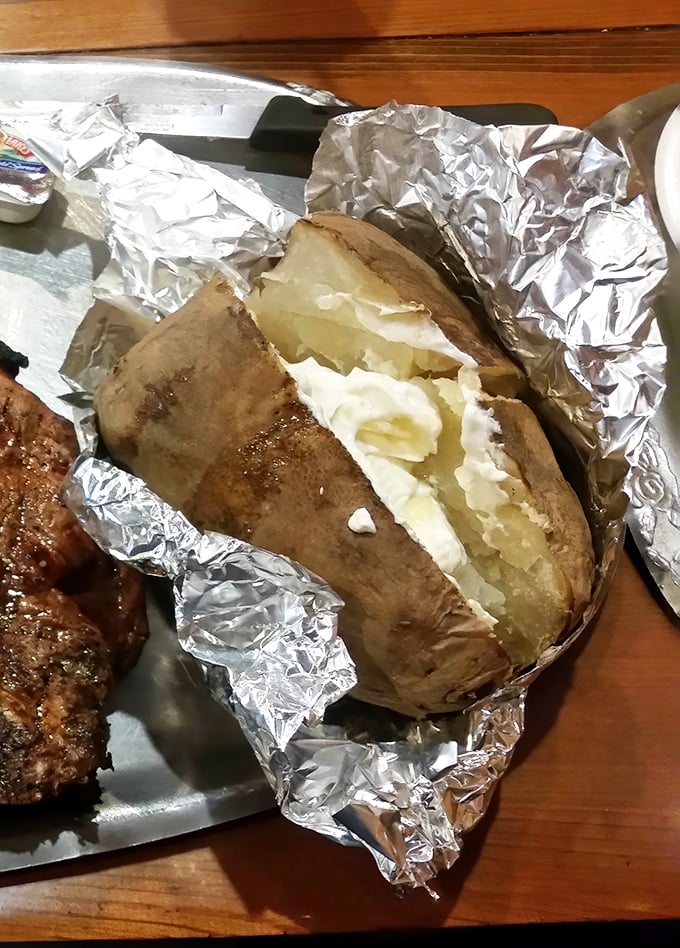 That baked potato wrapped in foil like a precious gift comes loaded with butter – because in Georgia, calories don't count when they're this delicious.