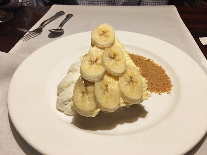 Not just dessert—it's architecture! Bananas stacked with military precision atop cream, proving that simple ingredients can create showstopping finales.