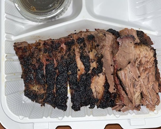 Behold the brisket—sporting a bark so beautiful it could make a tree jealous. That smoke ring is the BBQ equivalent of a halo.