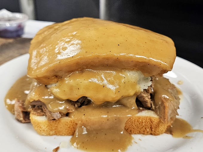 The Beef Manhattan—where tender roast beef meets mashed potatoes under a gravy waterfall. Comfort food architecture at its finest.