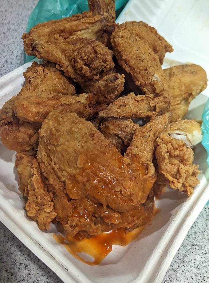 Crispy, juicy, and unapologetically straightforward. This mountain of fried chicken pieces isn't trying to impress you—yet somehow, it absolutely does.