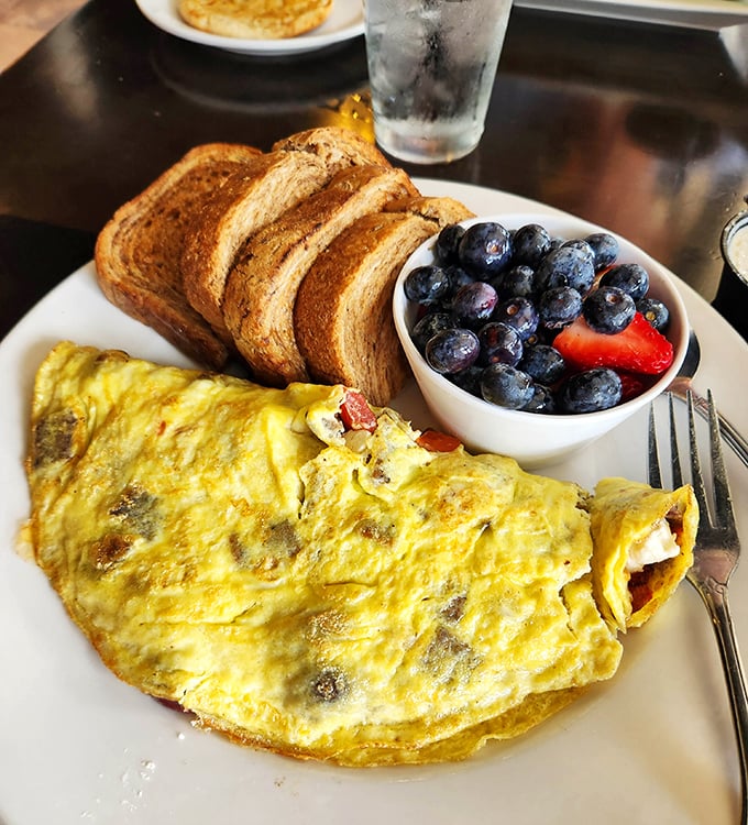 This omelet could double as a pillow – fluffy, generous, and stuffed with breakfast happiness.