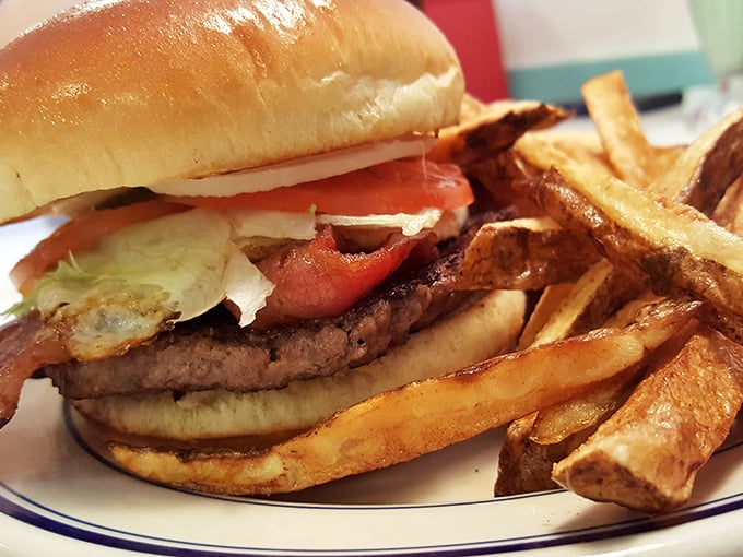 The burger that launched a thousand cravings—fresh toppings, perfectly charred patty, and those golden fries that somehow taste like childhood summers.
