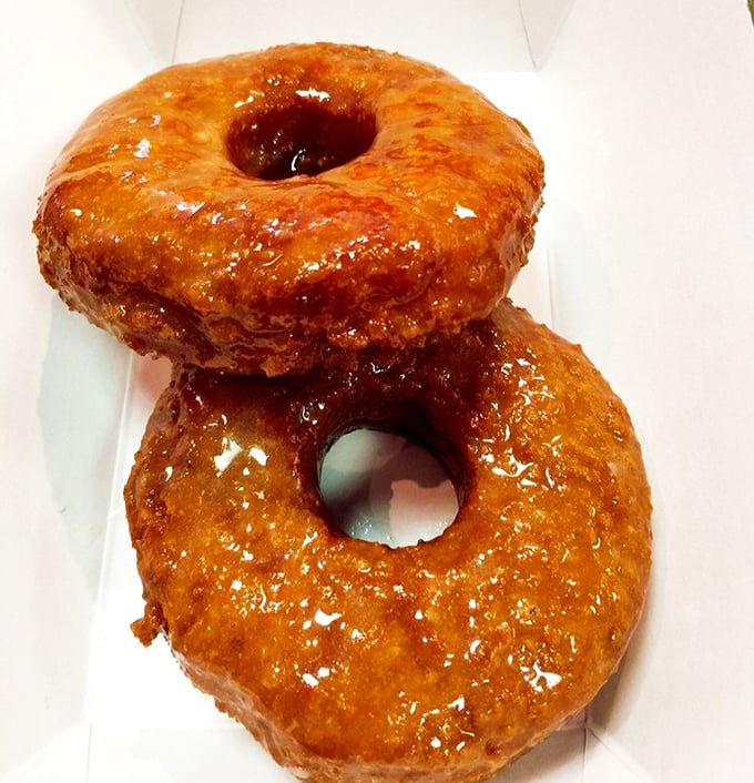 Glazed donuts that glisten like they've been touched by angels. Two stacked together is portion control at its most optimistic.