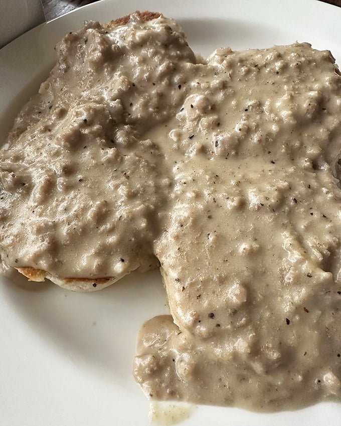Biscuits swimming in a sea of creamy sausage gravy—the breakfast equivalent of a warm hug from your favorite grandma.