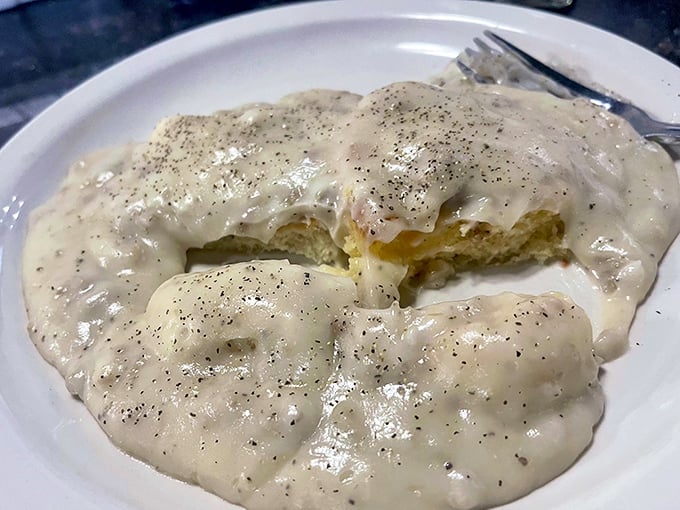 These biscuits and gravy aren't just a side dish—they're the main event, with pepper-speckled country gravy blanketing pillowy biscuits like a warm Southern hug.