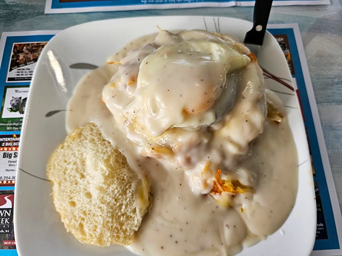 This isn't just biscuits and gravy—it's a gravity-defying masterpiece of creamy, peppery comfort that would make any Southern grandmother nod in approval.