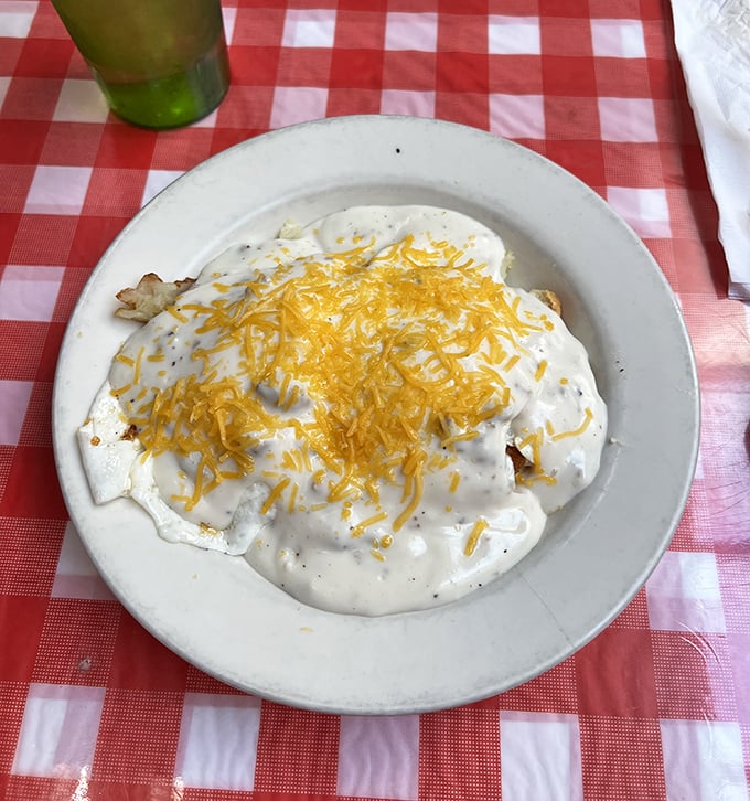 Southern comfort meets Midwestern hospitality in a plate of biscuits blanketed with creamy gravy that could make your grandmother jealous.