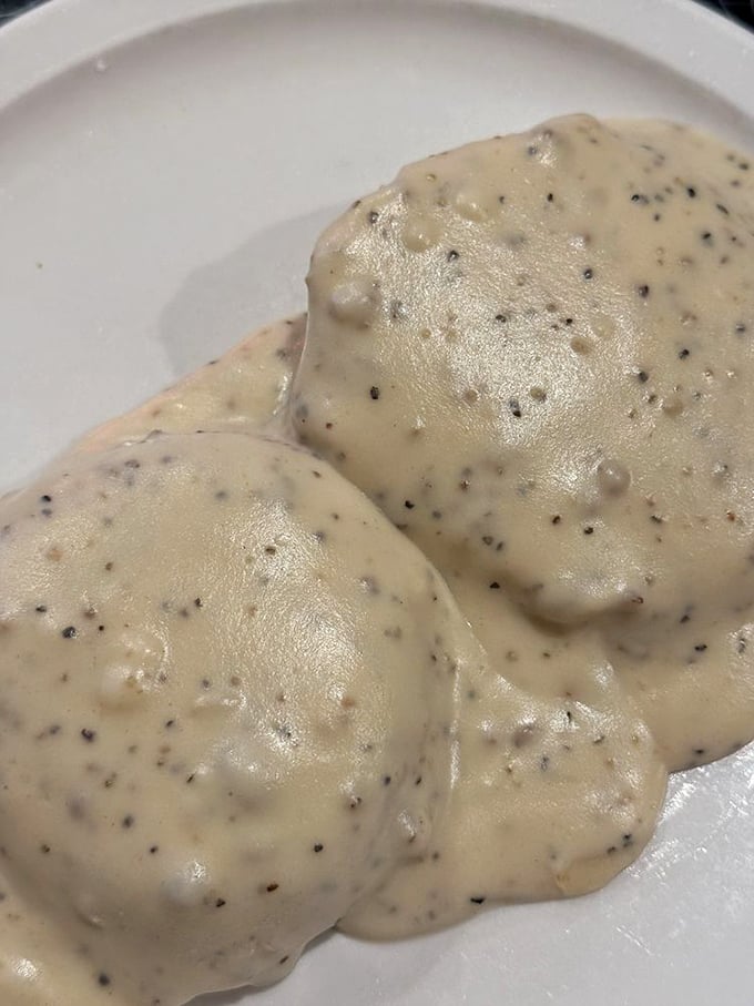 Biscuits and gravy – the comfort food equivalent of a warm hug from your grandmother, with pepper specks promising that perfect savory kick.