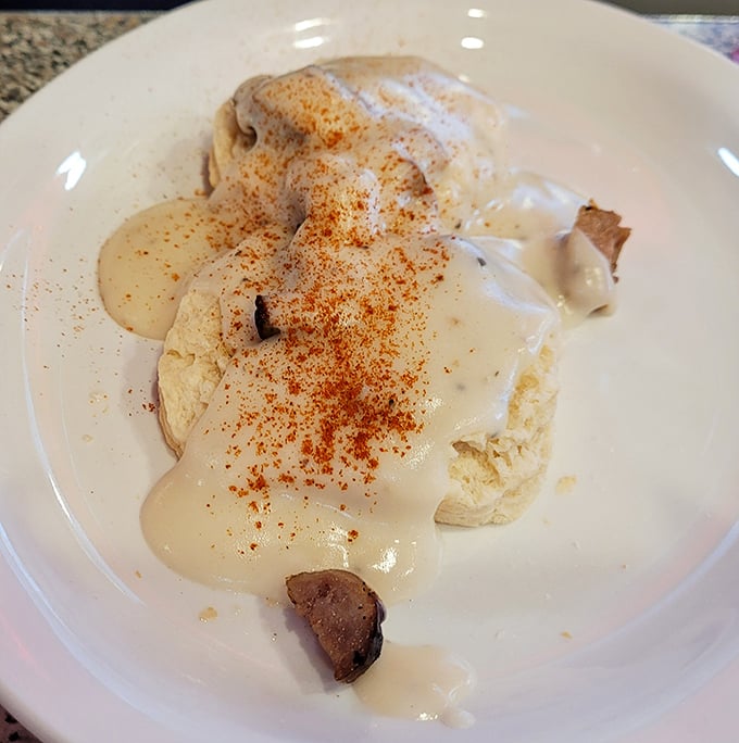 Biscuits and gravy that would make your grandmother both proud and jealous. That sprinkle of paprika isn't just garnish—it's a promise.