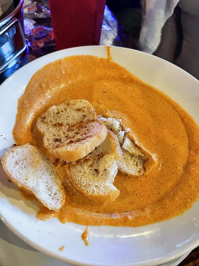 This bisque isn't just soup—it's a warm, spicy hug in a bowl that makes you want to write poetry about seafood.