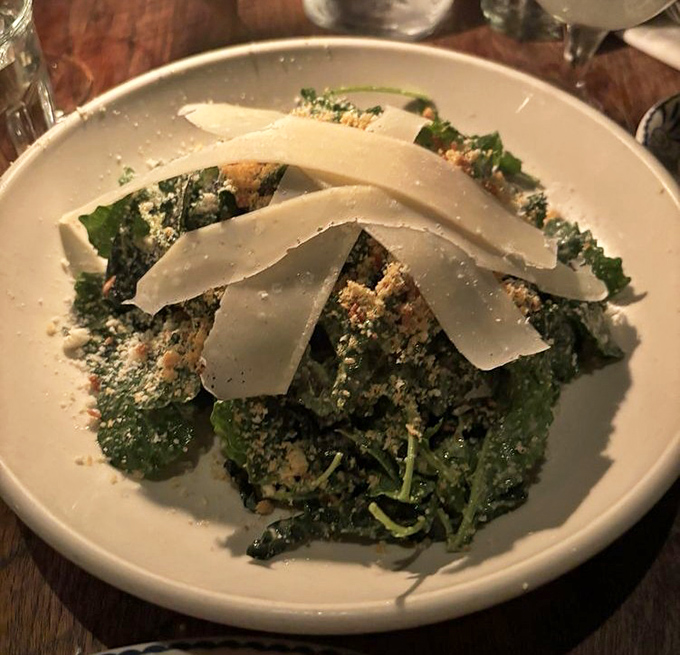 Kale Caesar that could convert even the most dedicated salad-avoider. Those shavings of Parmigiano-Reggiano aren't just garnish—they're little flavor bombs.