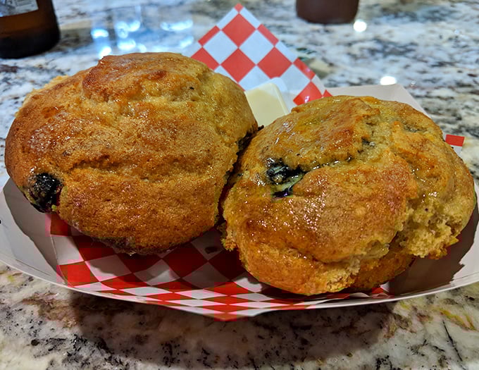 Cornbread muffins that straddle the sweet-savory divide like culinary tightrope walkers. These golden beauties might just upstage the meat – almost.