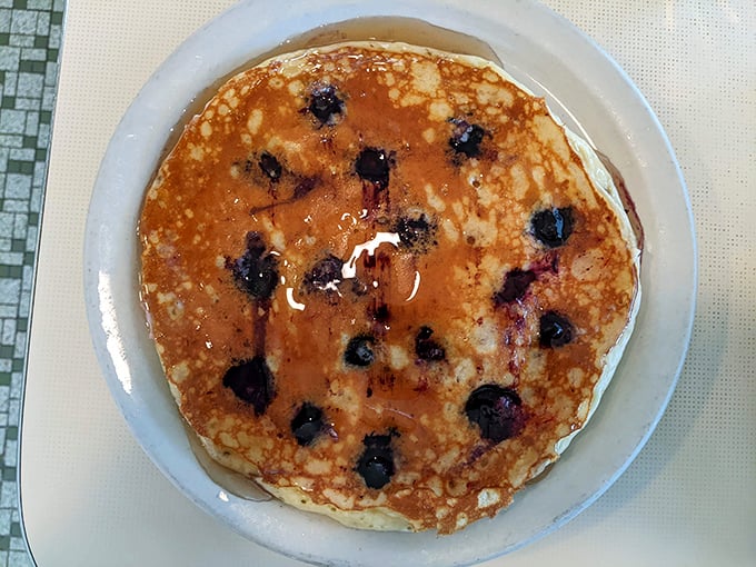 This blueberry pancake isn't just breakfast—it's a full-blown dessert disguised as a morning meal. Those bursts of berry goodness make every bite a celebration.