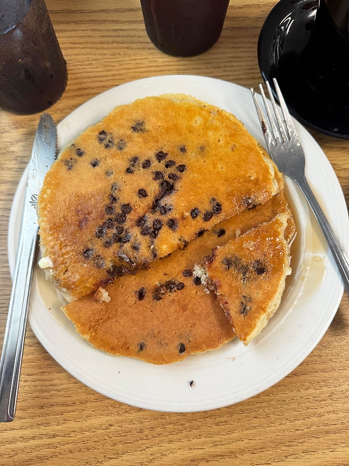 These blueberry-studded pancakes look like tiny bursts of summer sunshine decided to take up residence on your plate.