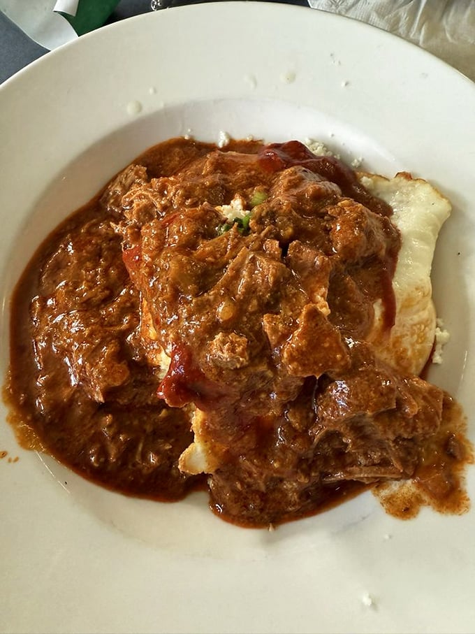 This isn't just pork shoulder—it's meat transformed by chile alchemy into something so tender it practically surrenders to your fork.