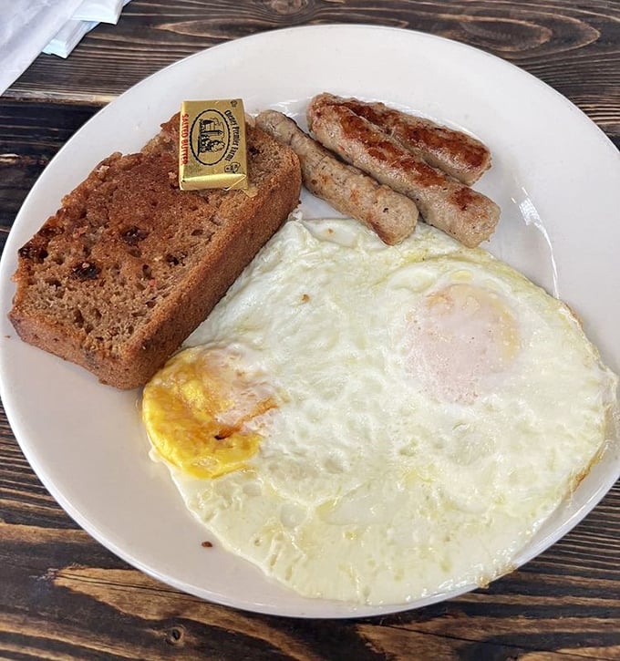 Breakfast perfection doesn't need to be complicated – just a perfectly cooked sunny-side-up egg, homemade bread, and sausage links that snap when bitten.