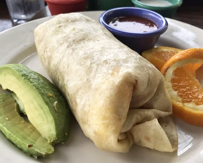 The breakfast burrito—nature's perfect food delivery system. Avocado on the side because California wouldn't have it any other way.