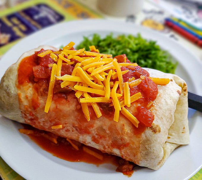 The breakfast burrito – where morning meets fiesta, topped with enough cheese to make Wisconsin nervous.