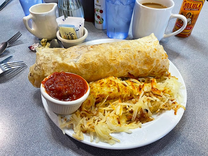 This breakfast burrito isn't just big—it's the kind of commitment that requires both hands and possibly a nap afterward.