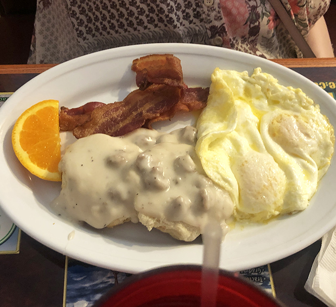 Sunny-side eggs, crispy bacon, and gravy-smothered biscuits—the breakfast trinity that's converted more morning skeptics than Sunday sermons.