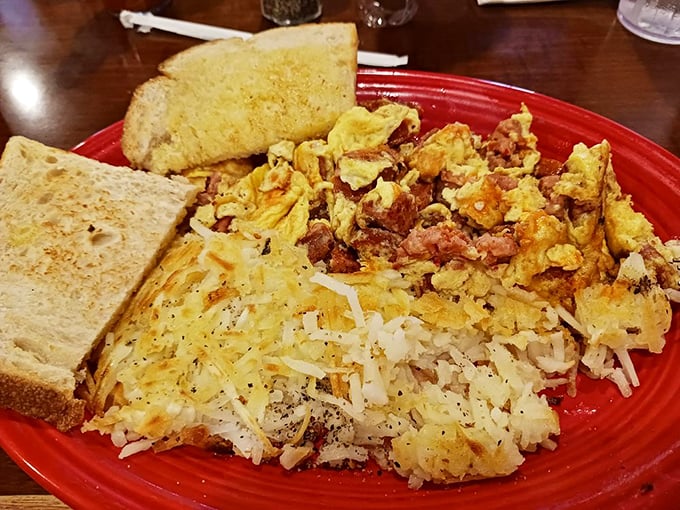 Breakfast platters that could fuel a cattle drive – scrambled eggs, crispy hash browns, and toast ready for adventure.