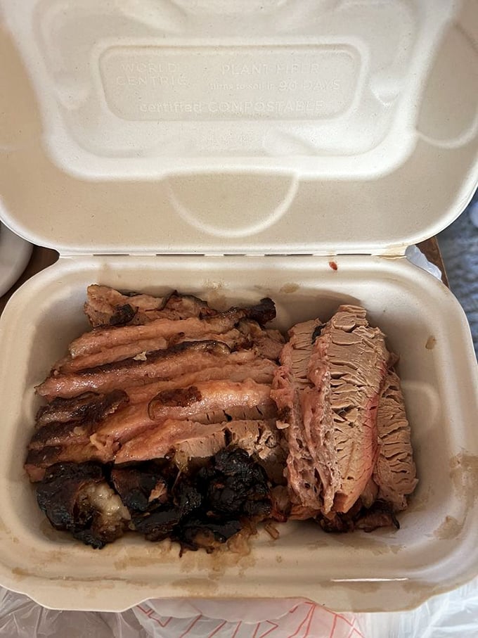 Brisket with that textbook smoke ring and sides that know their supporting role—this is the barbecue equivalent of a perfectly cast Oscar-winning ensemble.