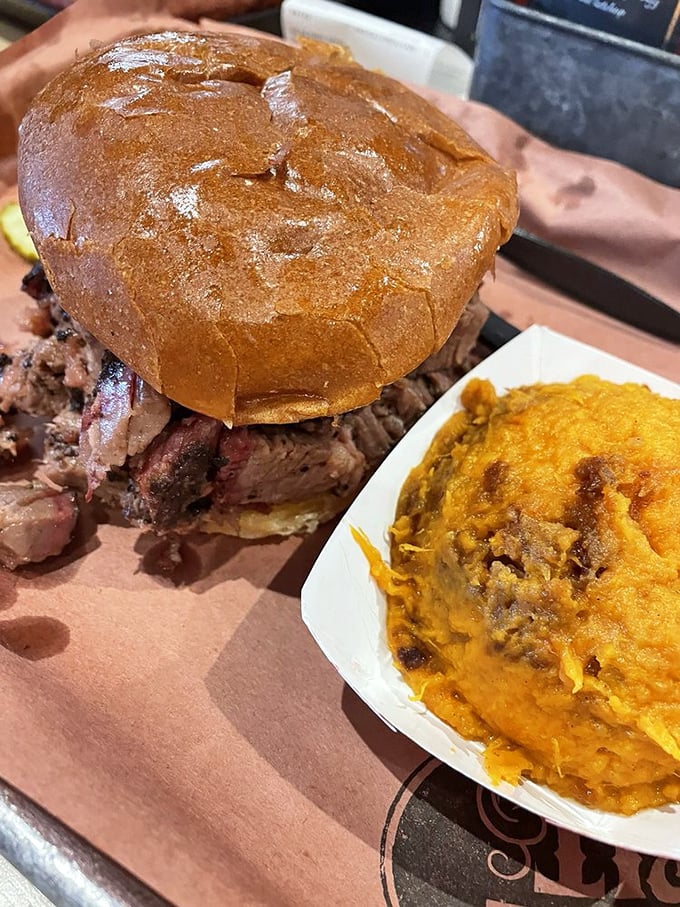 Brisket that would make a Texan tip their hat. This sandwich doesn't just satisfy hunger—it creates memories with each perfectly smoked, melt-in-your-mouth bite.