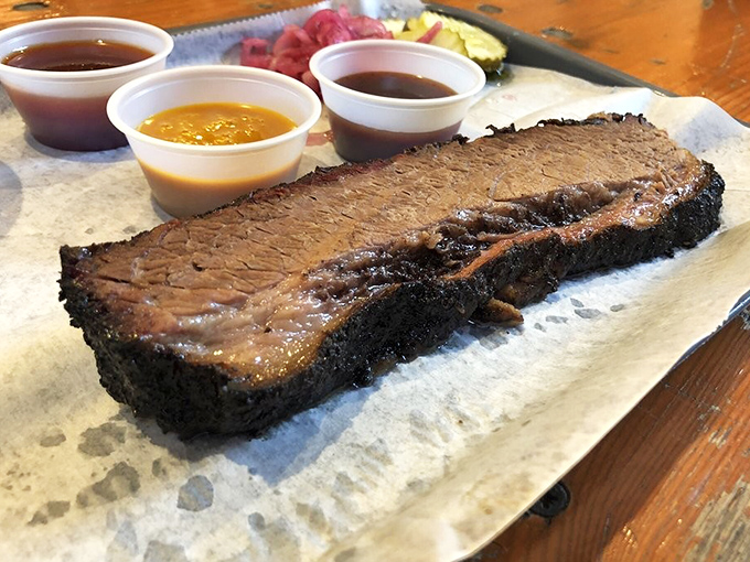 Brisket with that telltale smoke ring isn't just meat—it's edible evidence of someone who understands the sacred covenant between fire, time, and beef.