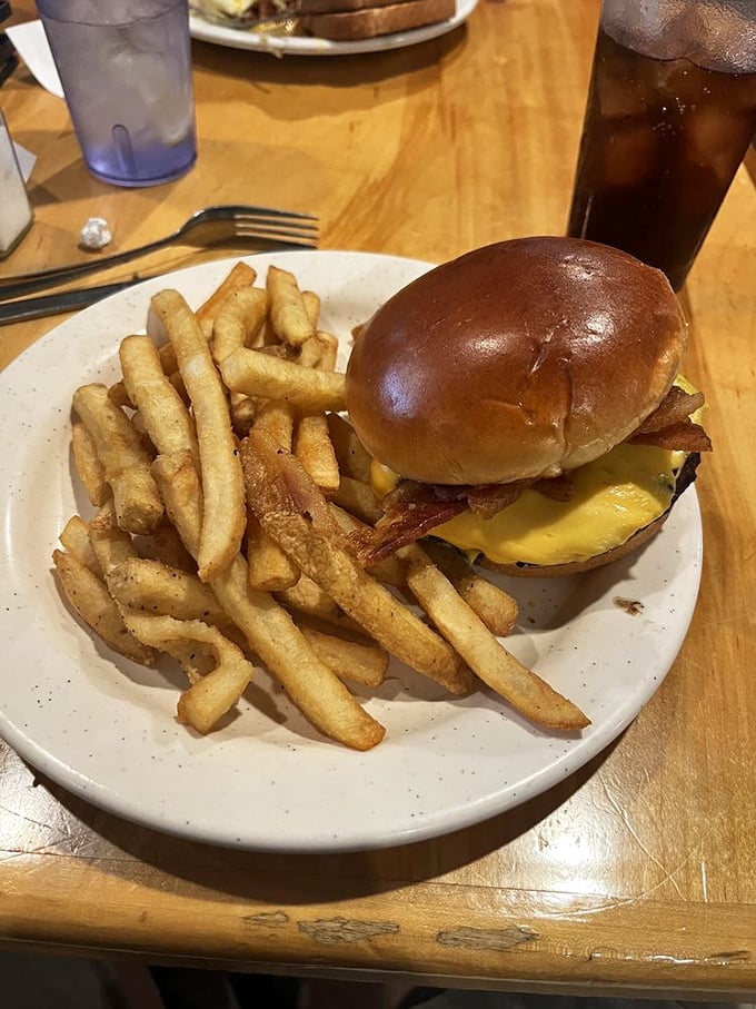 The Brunch Burger doesn't just break breakfast rules—it rewrites them with bacon, egg, and cheese atop a brioche bun that deserves its own fan club.
