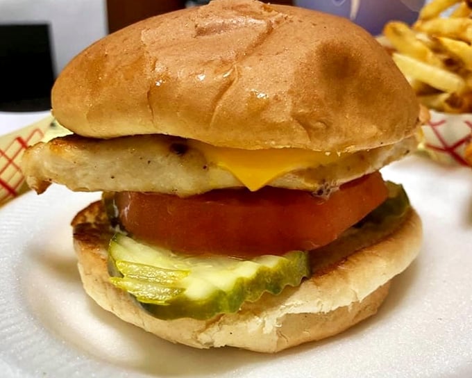 This isn't just a burger—it's edible nostalgia. The perfect ratio of beef, cheese, pickle, and tomato creates a harmony that fancy $20 burgers often miss entirely.