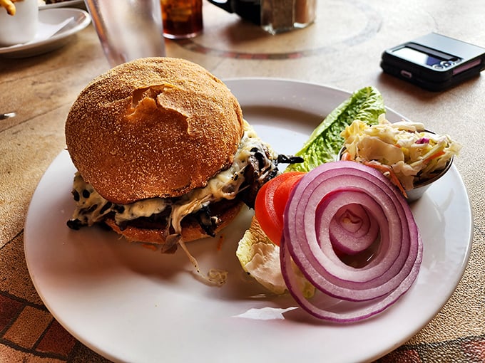This isn't just a burger; it's an architectural marvel of beef, cheese, and toppings on a perfectly toasted bun.