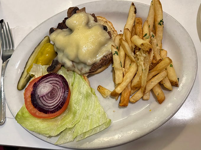 A burger that requires both hands and a strategy. The melted cheese isn't just a topping—it's a commitment to excellence.