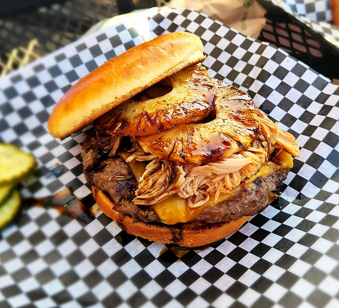 Behold the burger that launched a thousand road trips. That pulled pork topping isn't just a garnish—it's a game-changer.