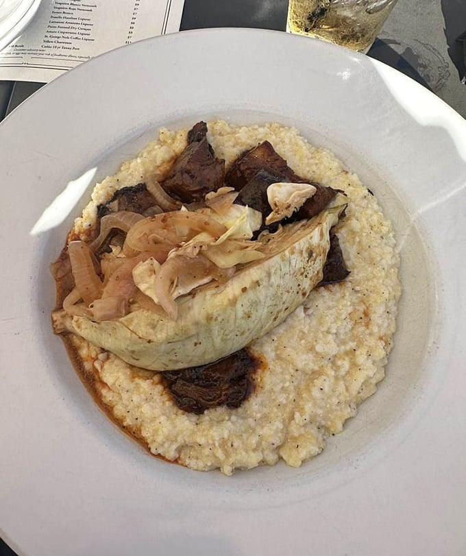 Burnt ends nestled on creamy grits—proof that when Midwest meets South, everybody wins, especially your taste buds.