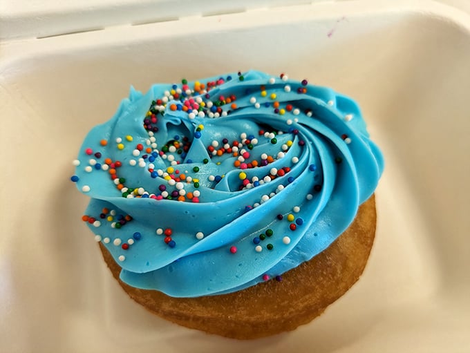 Blue buttercream swirled to perfection and topped with rainbow sprinkles—this donut doesn't just taste like happiness, it looks like the celebration itself.
