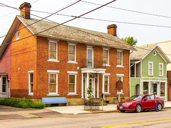 This charming brick residence with its perfect symmetry and welcoming front porch tells stories of generations who've called McConnelsville home.